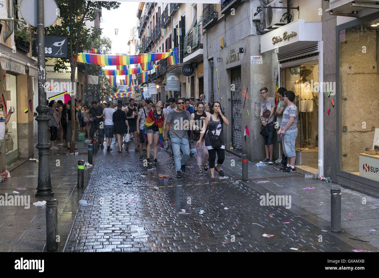 Attendees enjoy the Madrid Pride festivities with a water battle ...