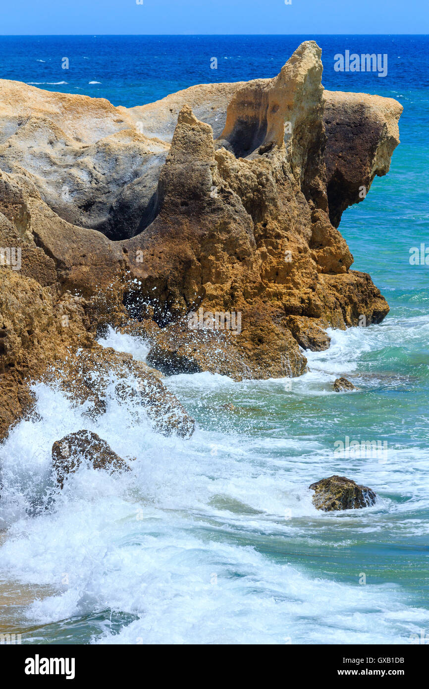 Summer Atlantic rocky coast view with splashes from waves (Albufeira ...