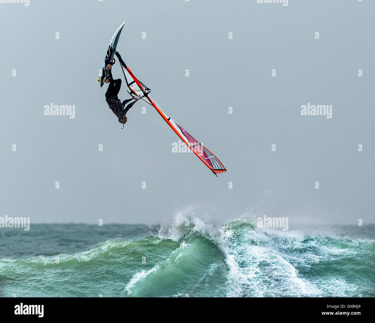 Flying the waves windsurfing Stock Photo - Alamy