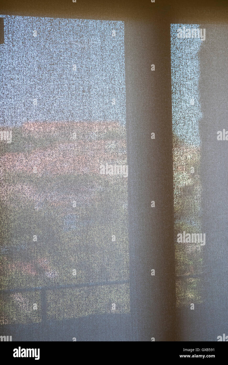 Window light. View of town from museum window seen through window ...