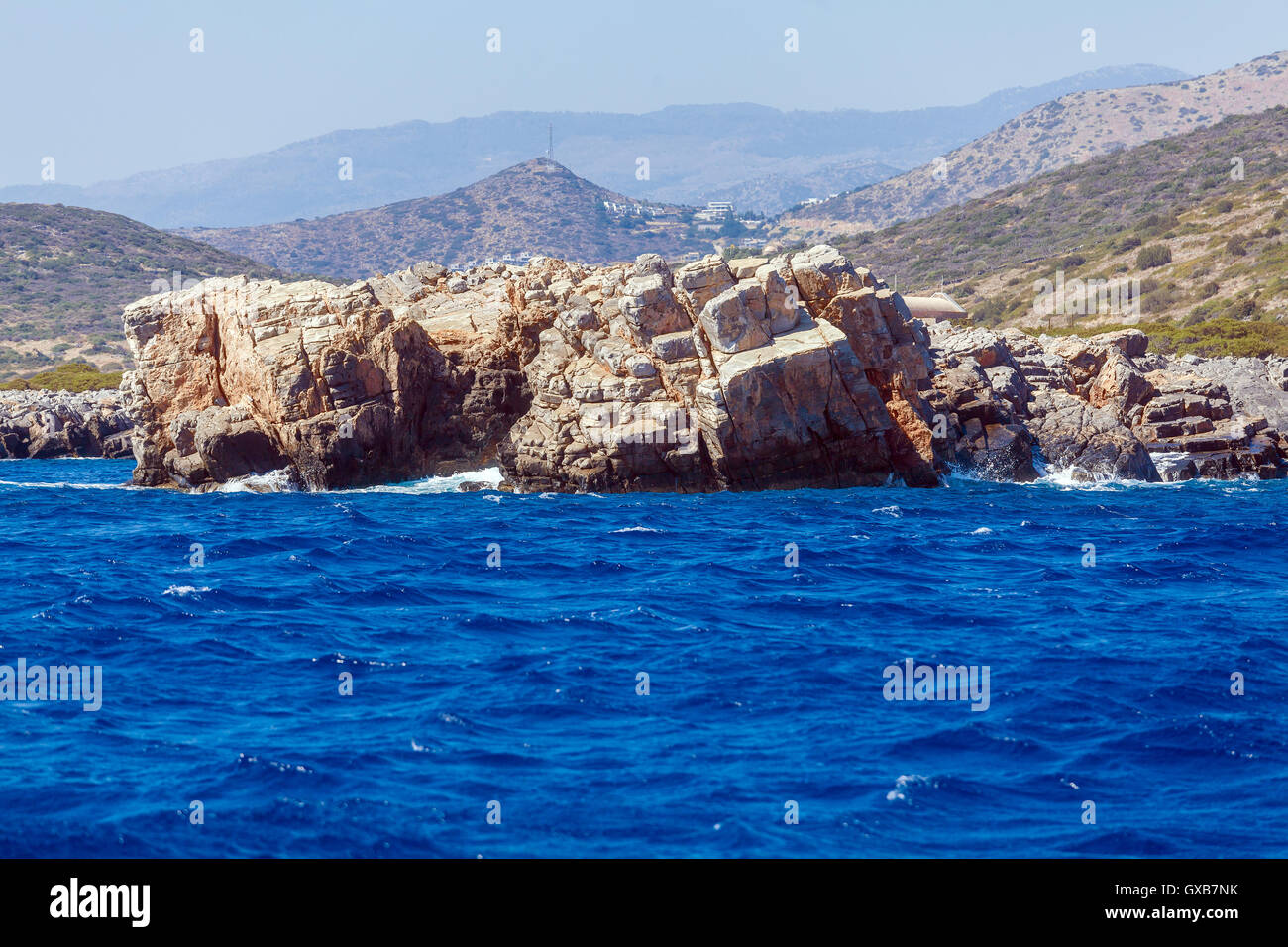 White waves and sea cliffs - typical landscape of Crete shores, Greece ...