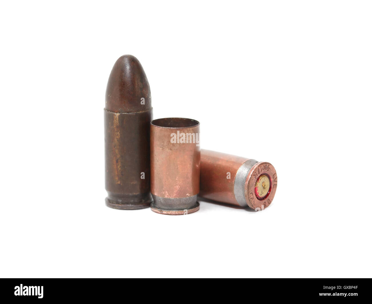 Pistol cartridge near gun shells on white background Stock Photo - Alamy