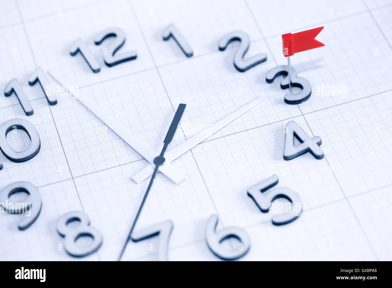 Deadline concept. Clock face with red flag pin on background with graph ...