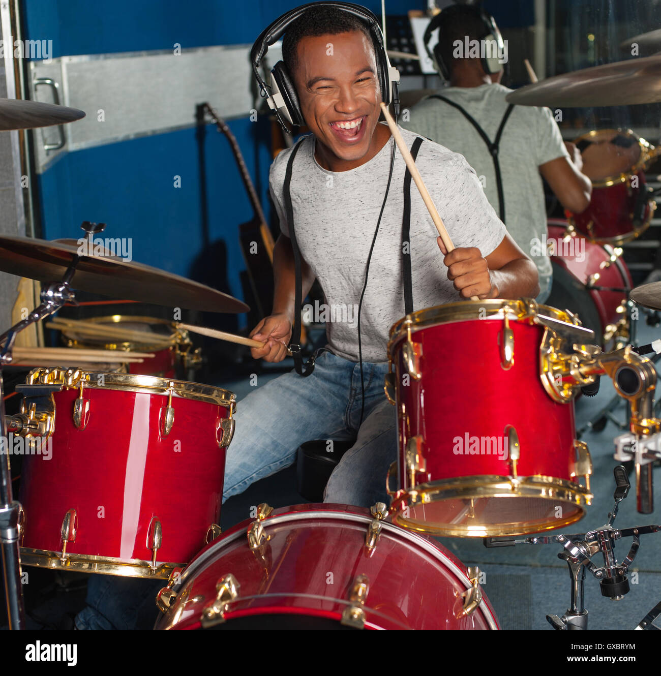 Young cheerful drummer playing drum hi-res stock photography and images ...