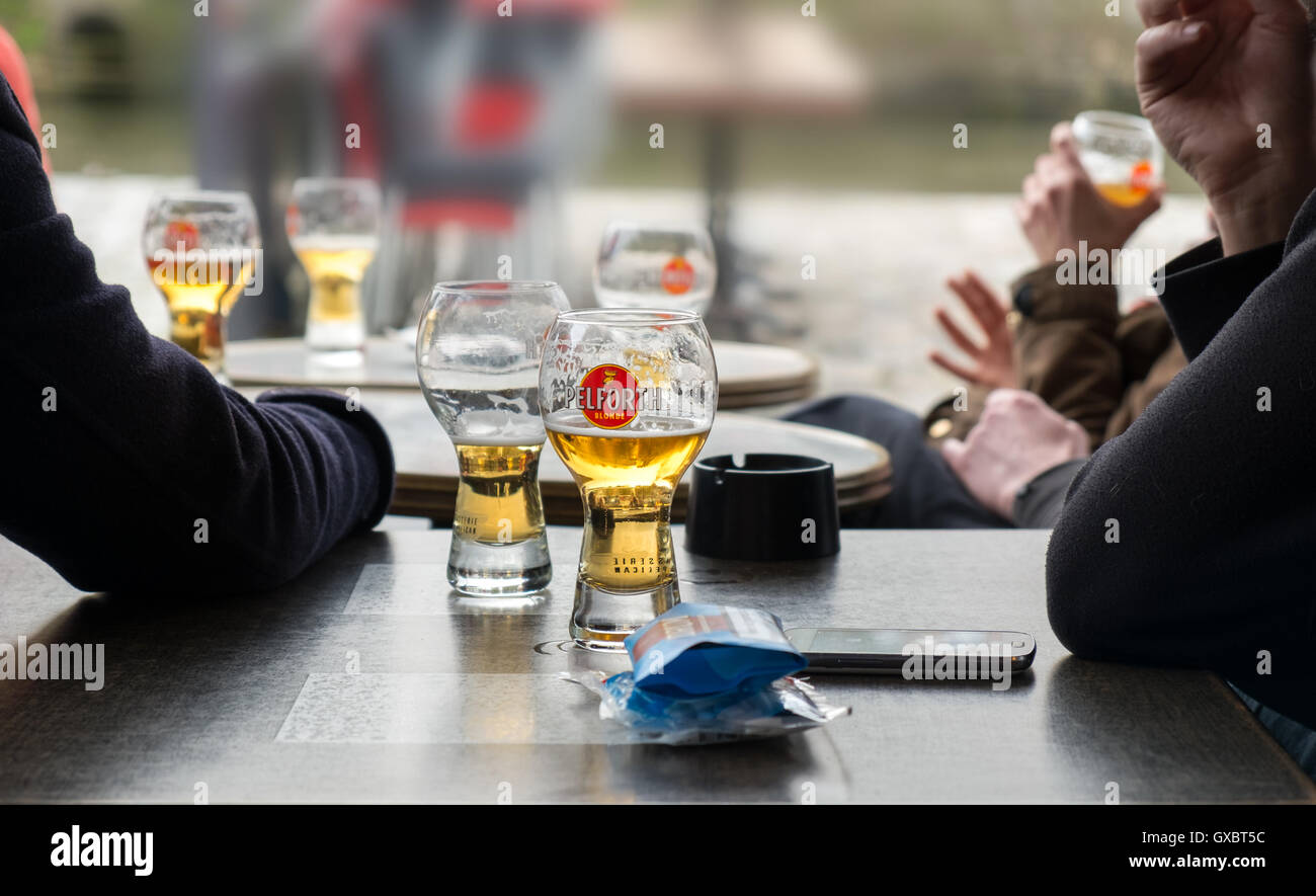 People drinking beer and smoking. Pelforth lager Stock Photo - Alamy