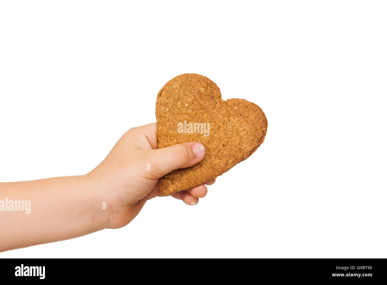 Child hand holding gingerbread Stock Photo - Alamy