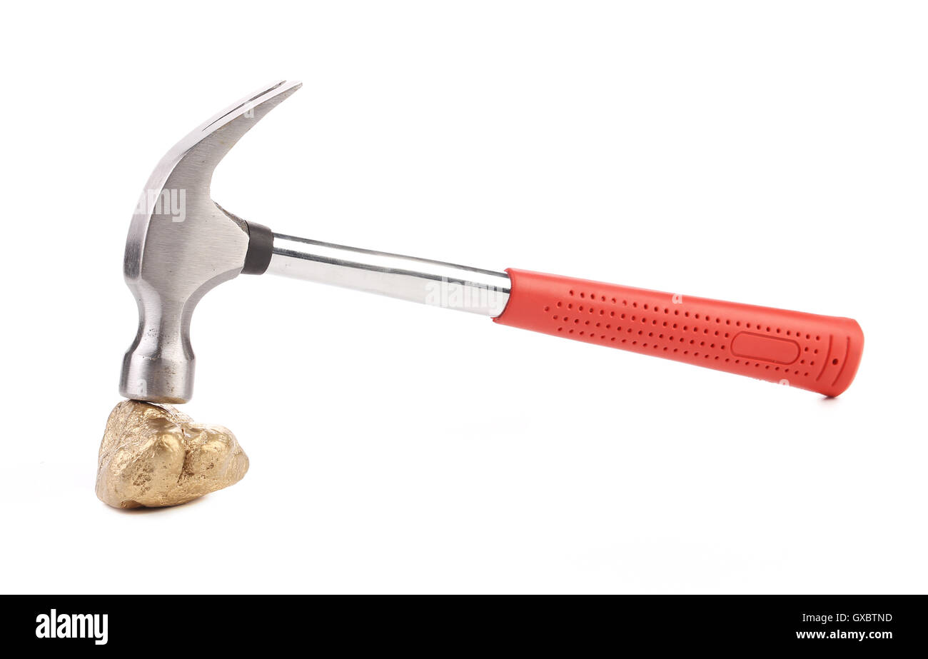 Close up of gold nugget and hammer Stock Photo - Alamy