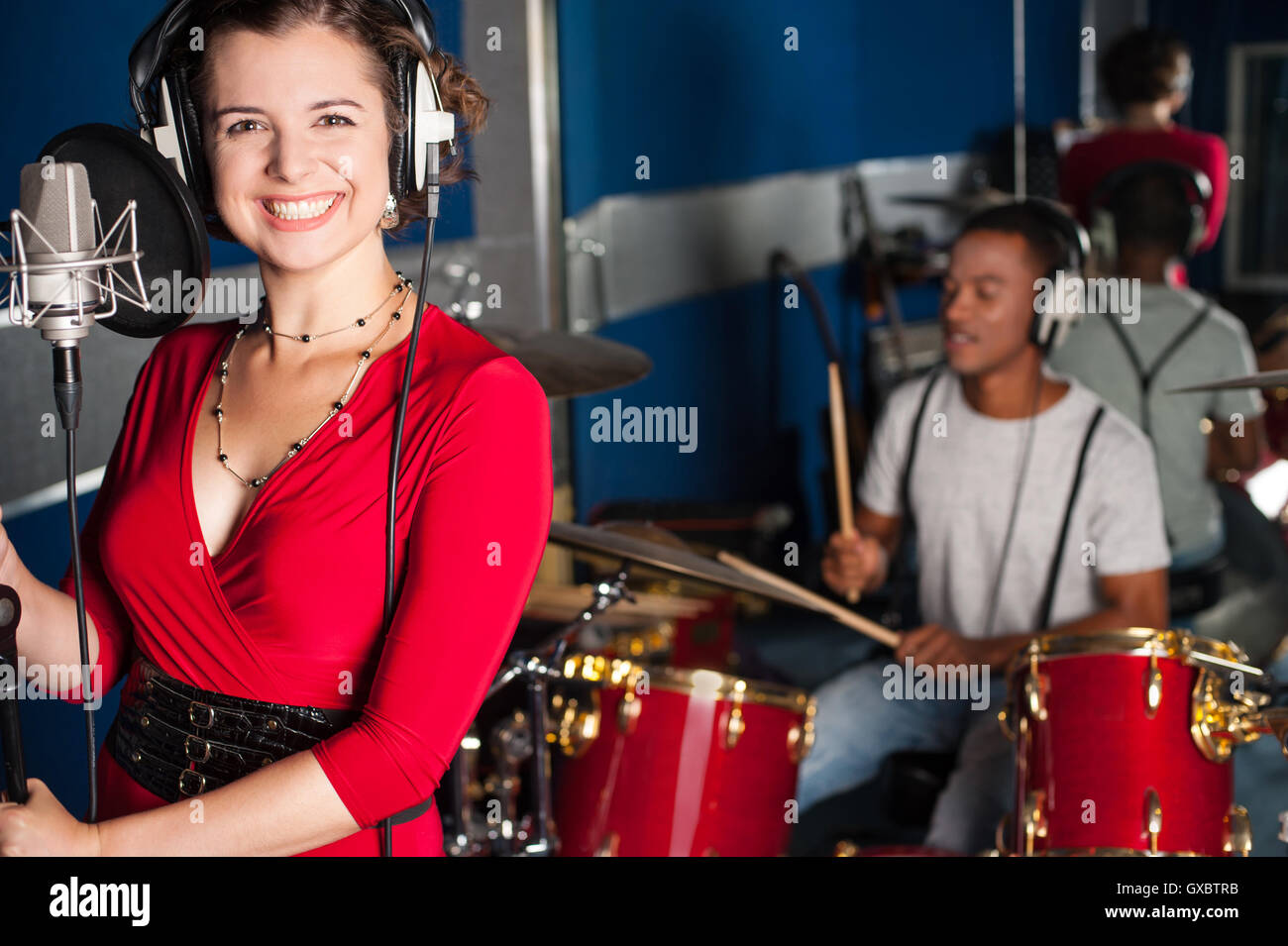 Female singer recording a track in studio Stock Photo - Alamy