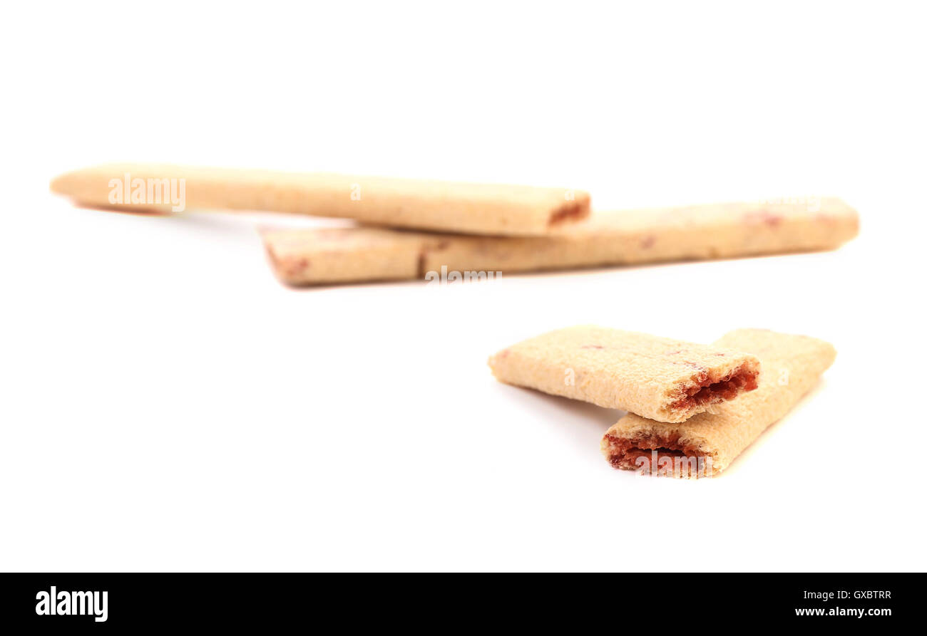 Broken biscuit sticks with filling Stock Photo - Alamy