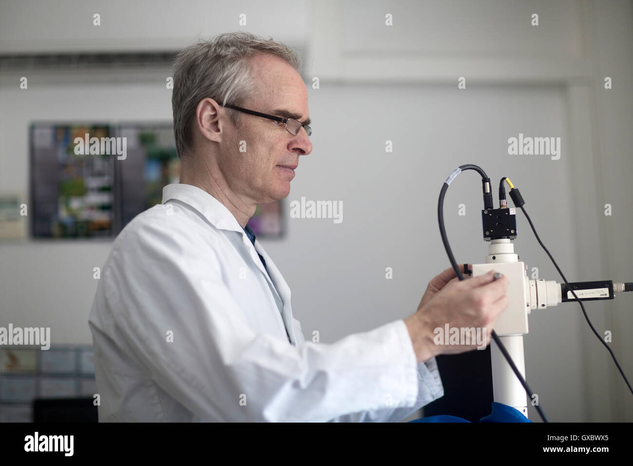 Male meteorologist using equipment in weather station laboratory Stock ...