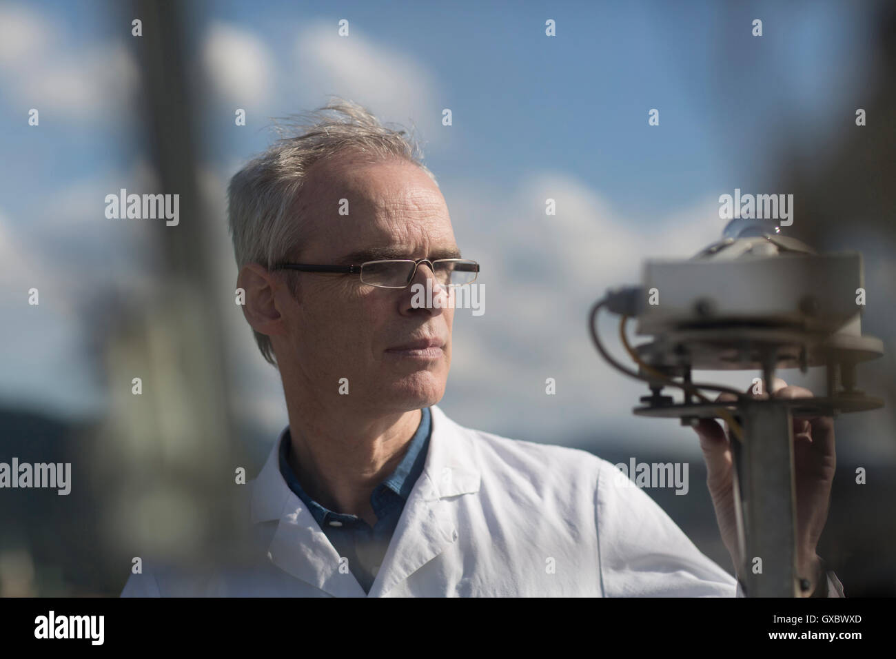 Male meteorologist monitoring meteorological equipment at weather ...