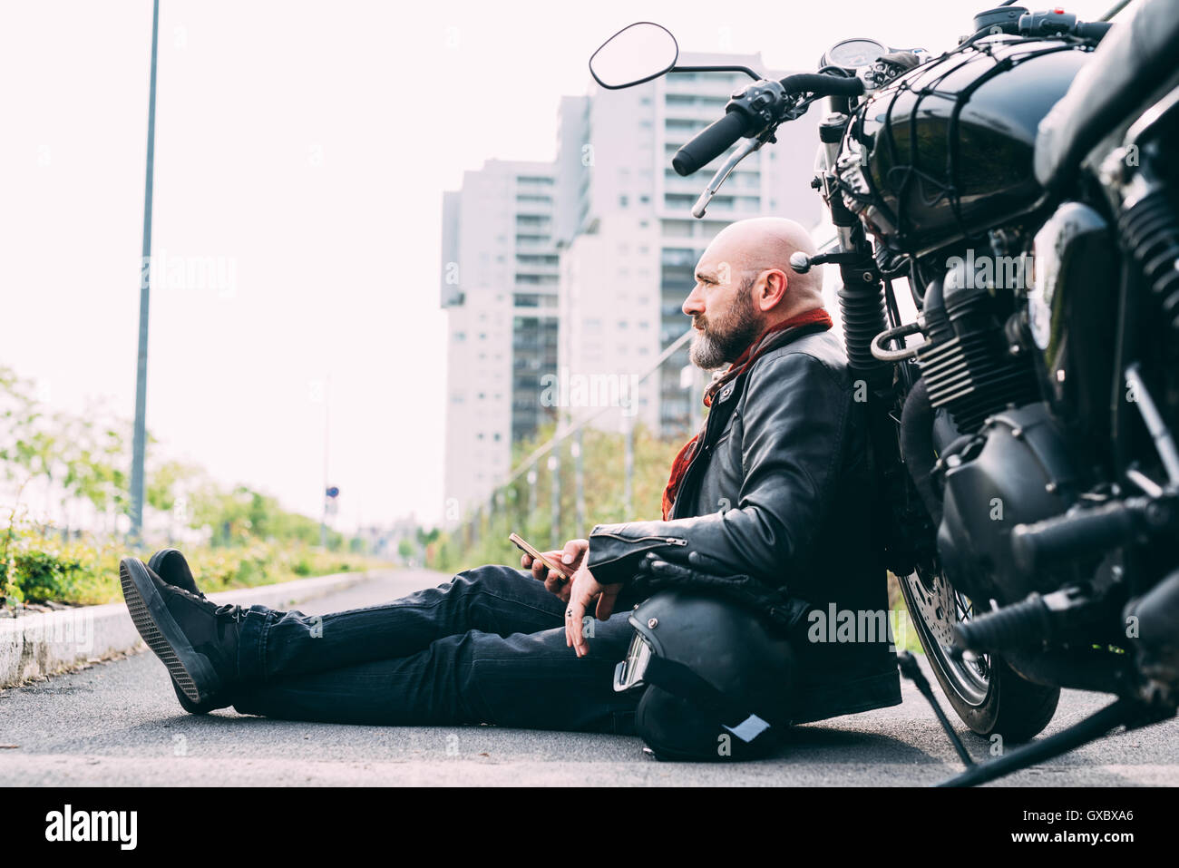 Mature man leaning on motorcycle hi-res stock photography and images ...