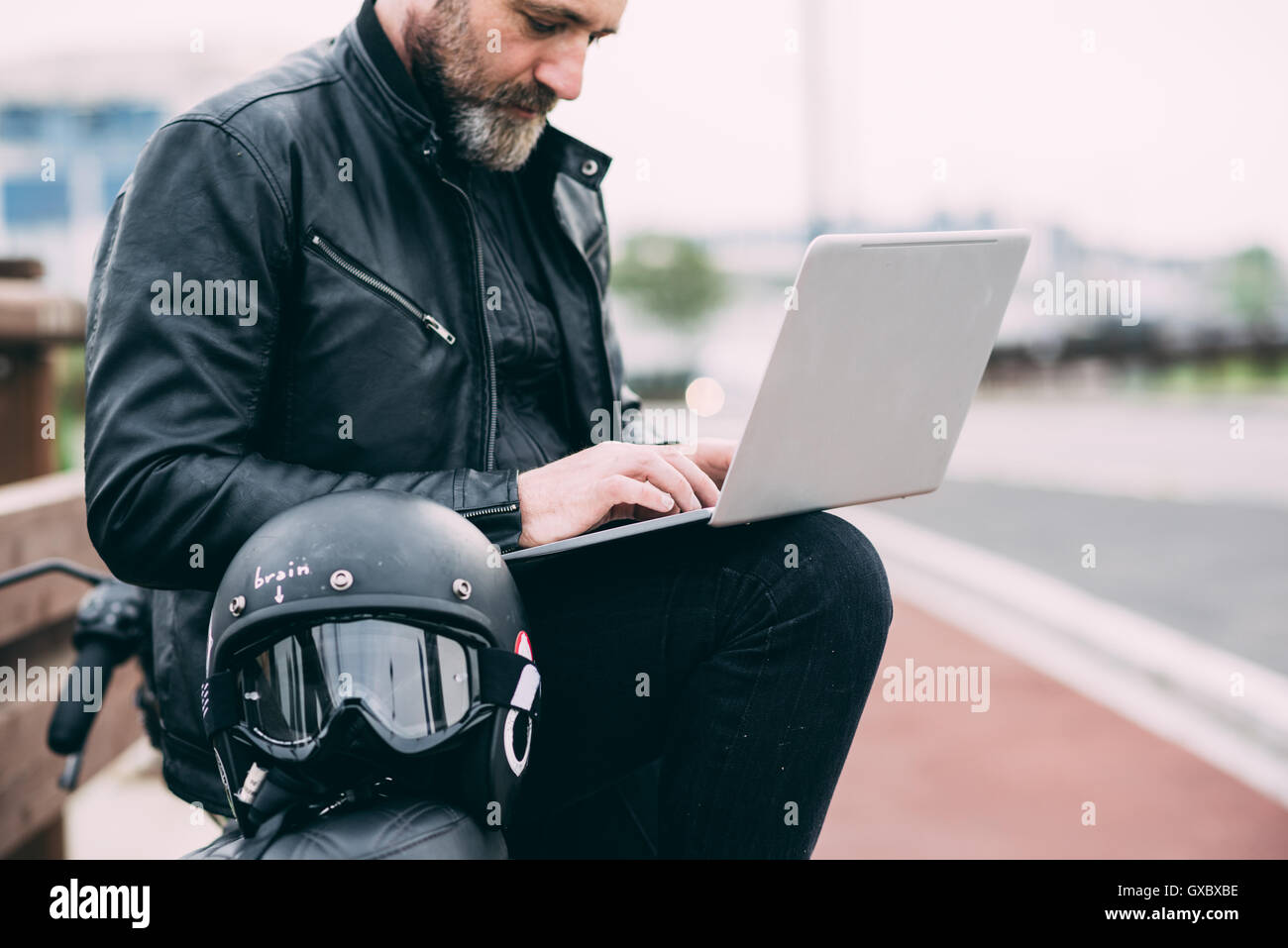 Using computer at side of road hi-res stock photography and images - Alamy