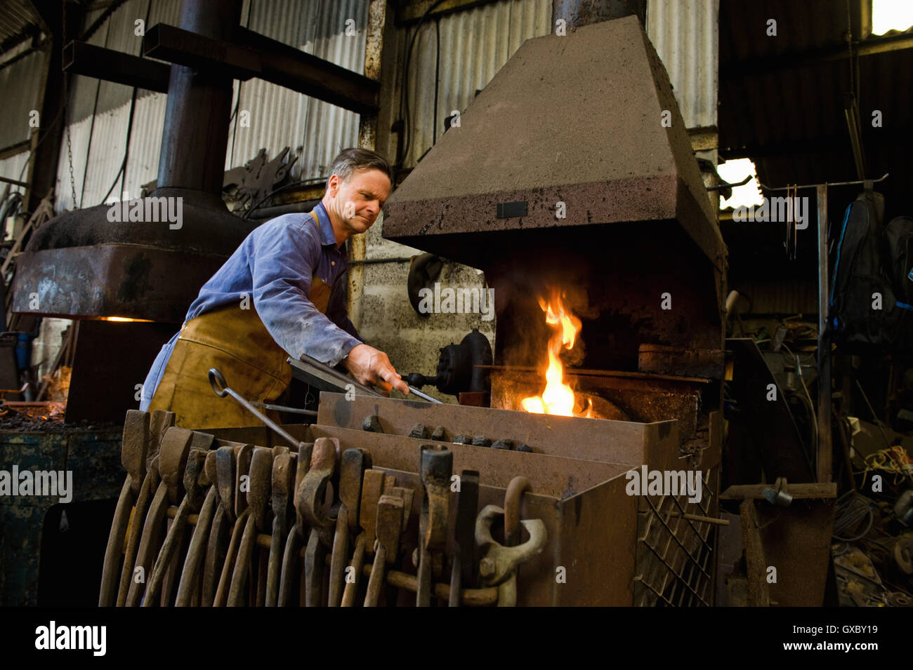 Blacksmith at work Stock Photo - Alamy