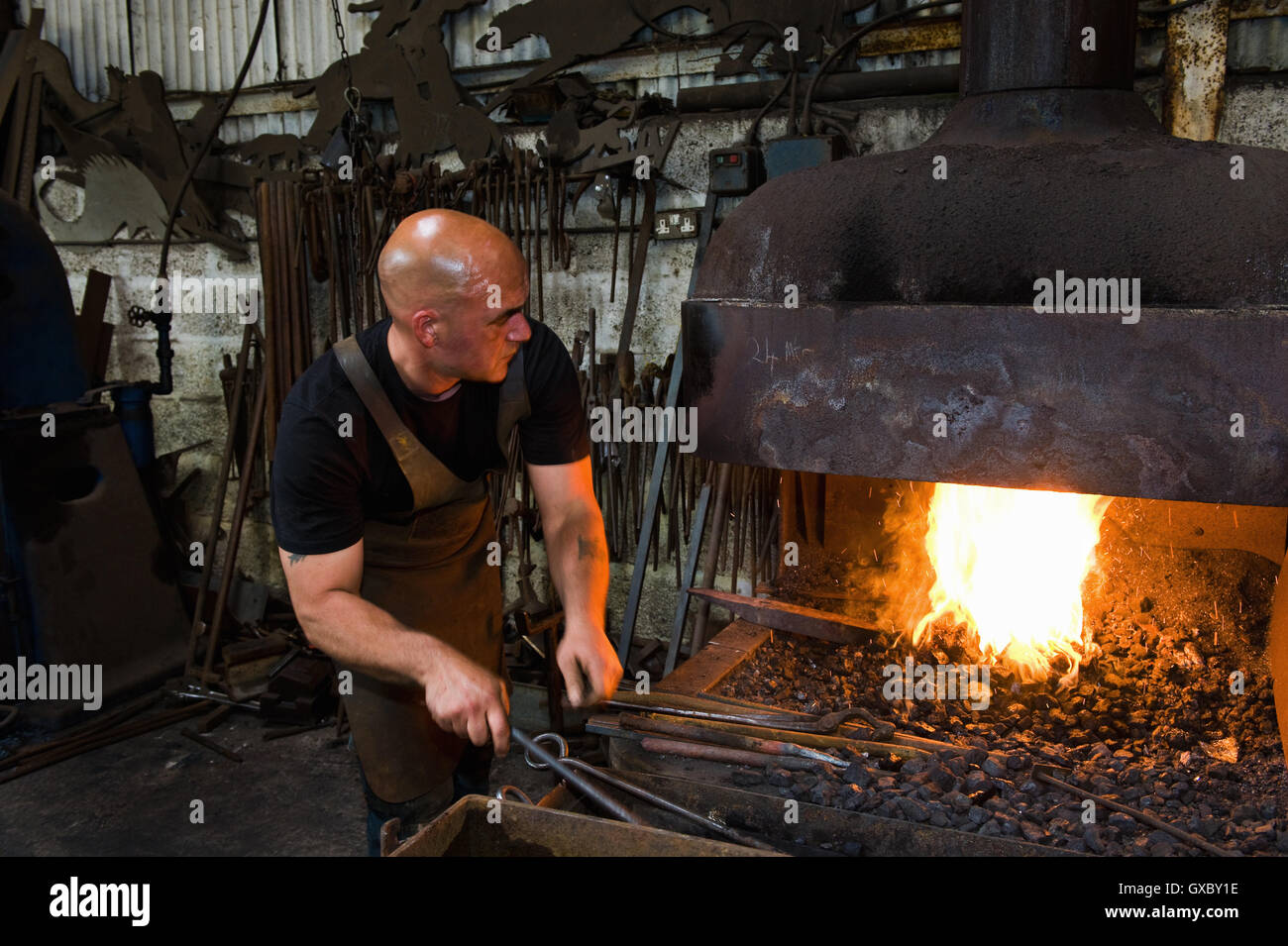 Blacksmith at work Stock Photo - Alamy