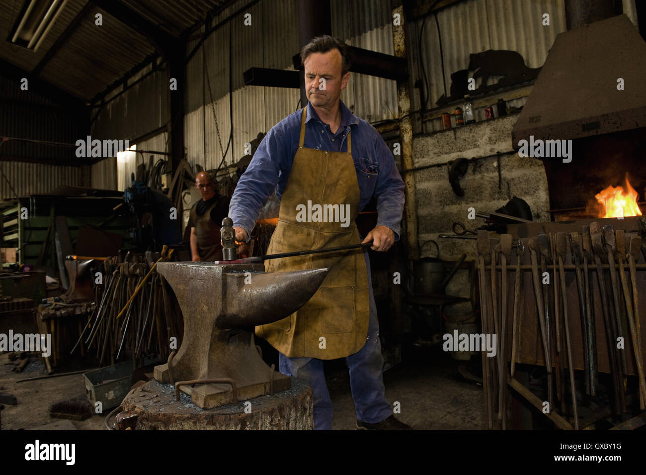 Blacksmith at work Stock Photo - Alamy