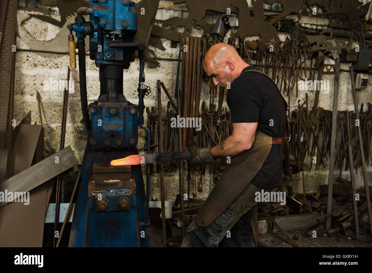 Blacksmith at work Stock Photo - Alamy