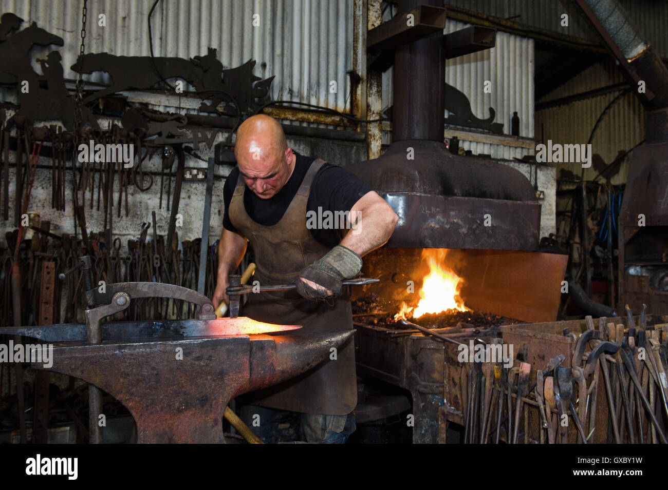 Blacksmith at work Stock Photo - Alamy
