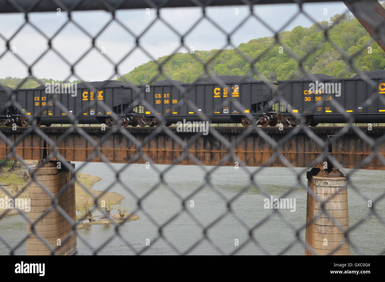 A loaded CSX coal train crosses the Potomac River Bridge at Harpers Ferry, Jefferson County ...