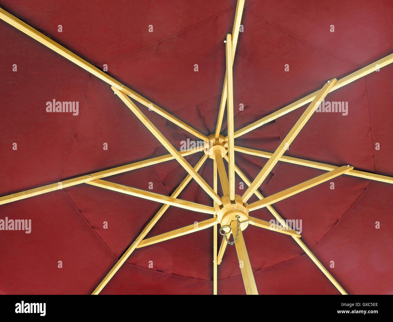 The inside of an open red umbrella Stock Photo - Alamy