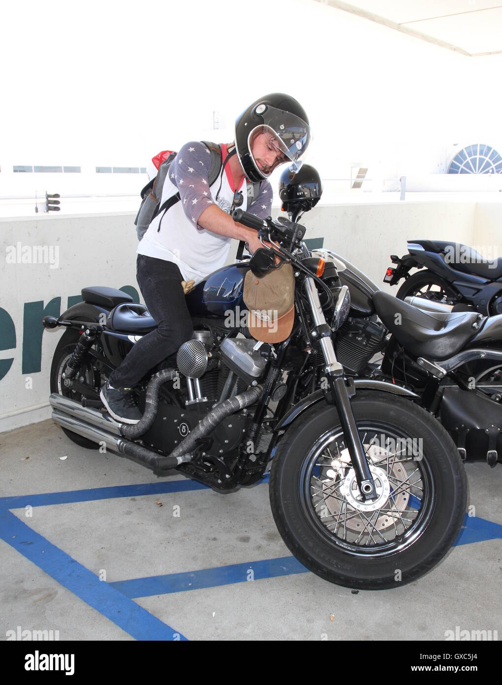 Josh Hutcherson arrives on a motorcycle and departs from LAX Featuring ...