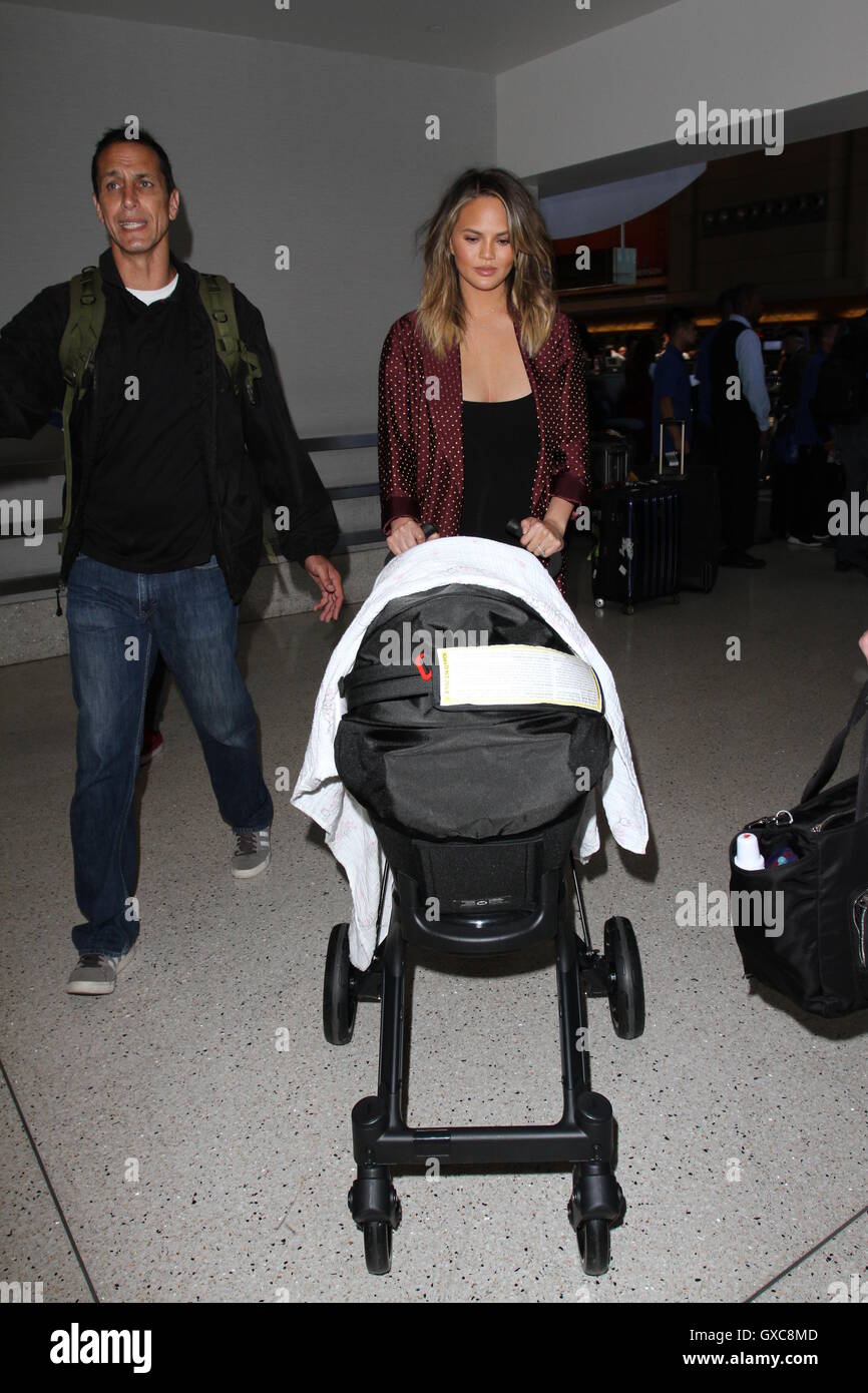 John Legend and Chrissy Teigen depart from the airport with recently ...
