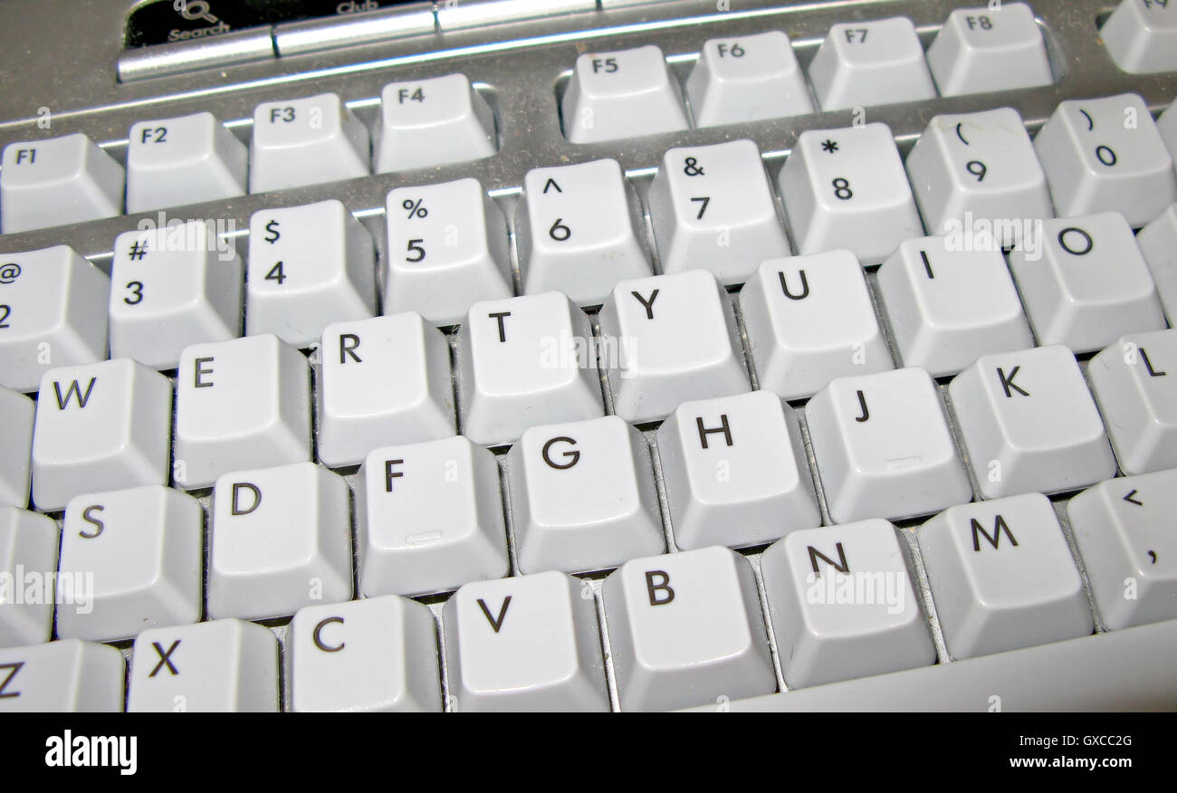 A dusty white keyboard of a computer Stock Photo - Alamy