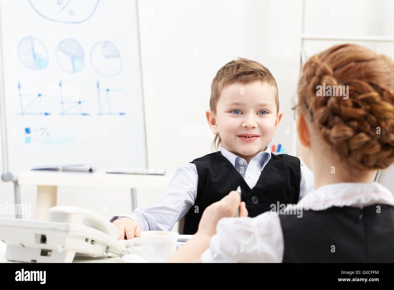 Kids negotiating business Stock Photo - Alamy