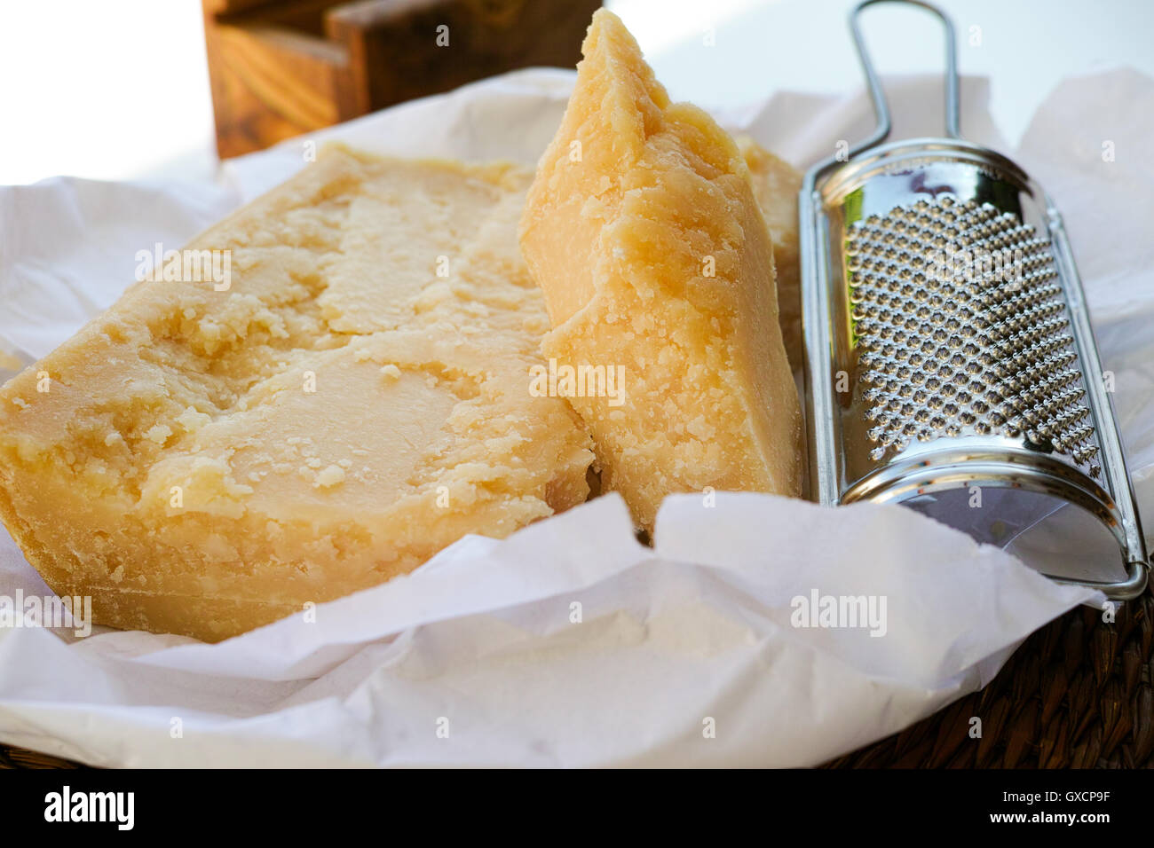 Parmesan cheese Parmesan Cheese Grater on white paper Stock Photo - Alamy