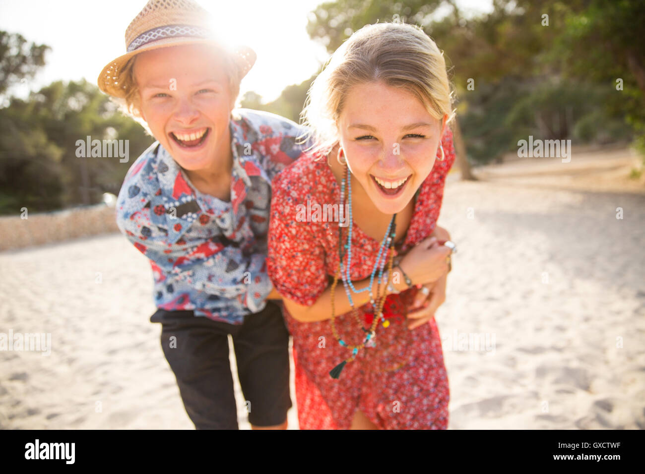 Couple on beach fooling around, looking at camera, Majorca, Spain Stock ...