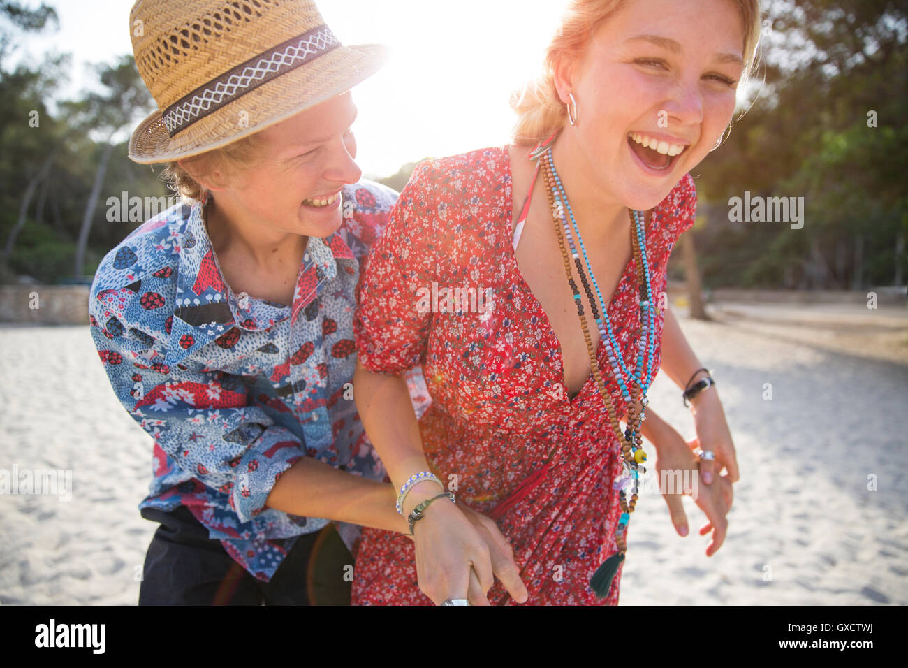 Couple on beach fooling around, looking at camera, Majorca, Spain Stock ...