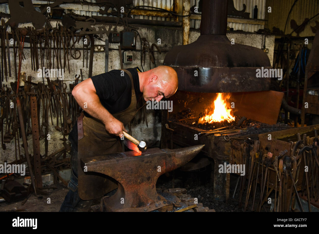 Blacksmith at work Stock Photo - Alamy