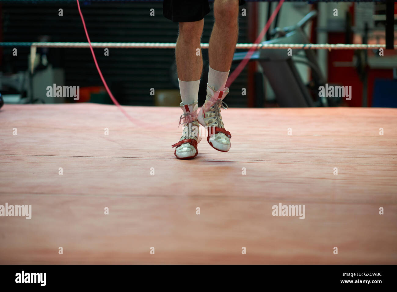 Boxer skipping in boxing ring, low section Stock Photo - Alamy