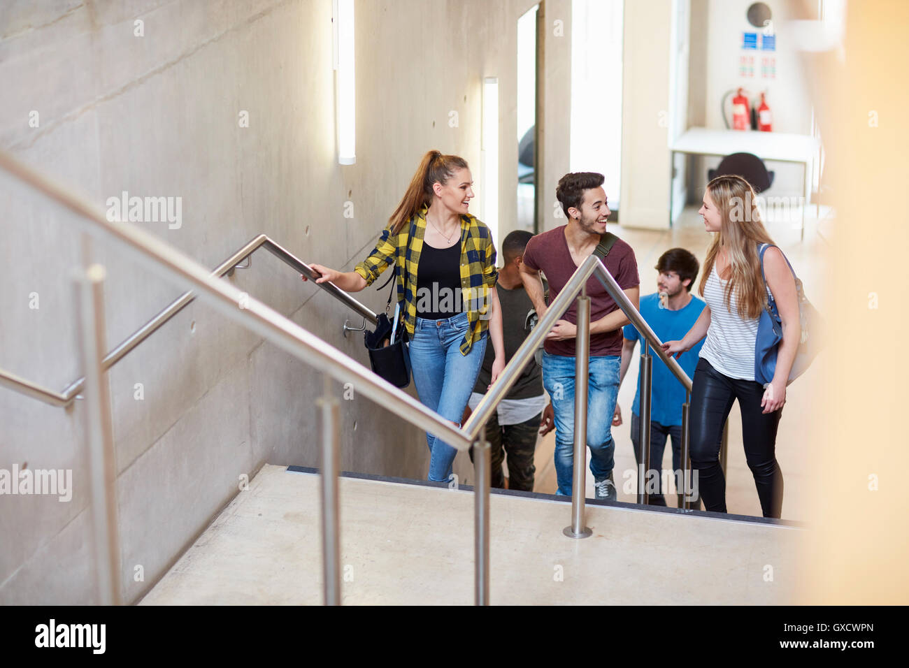 Group of students moving up stairway at higher education college Stock ...