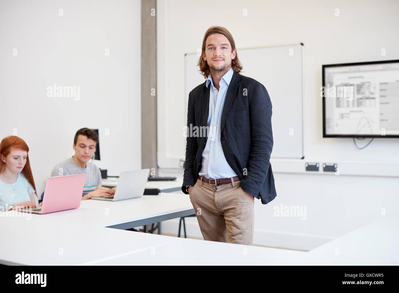 Portrait of male lecturer in higher education college classroom Stock ...