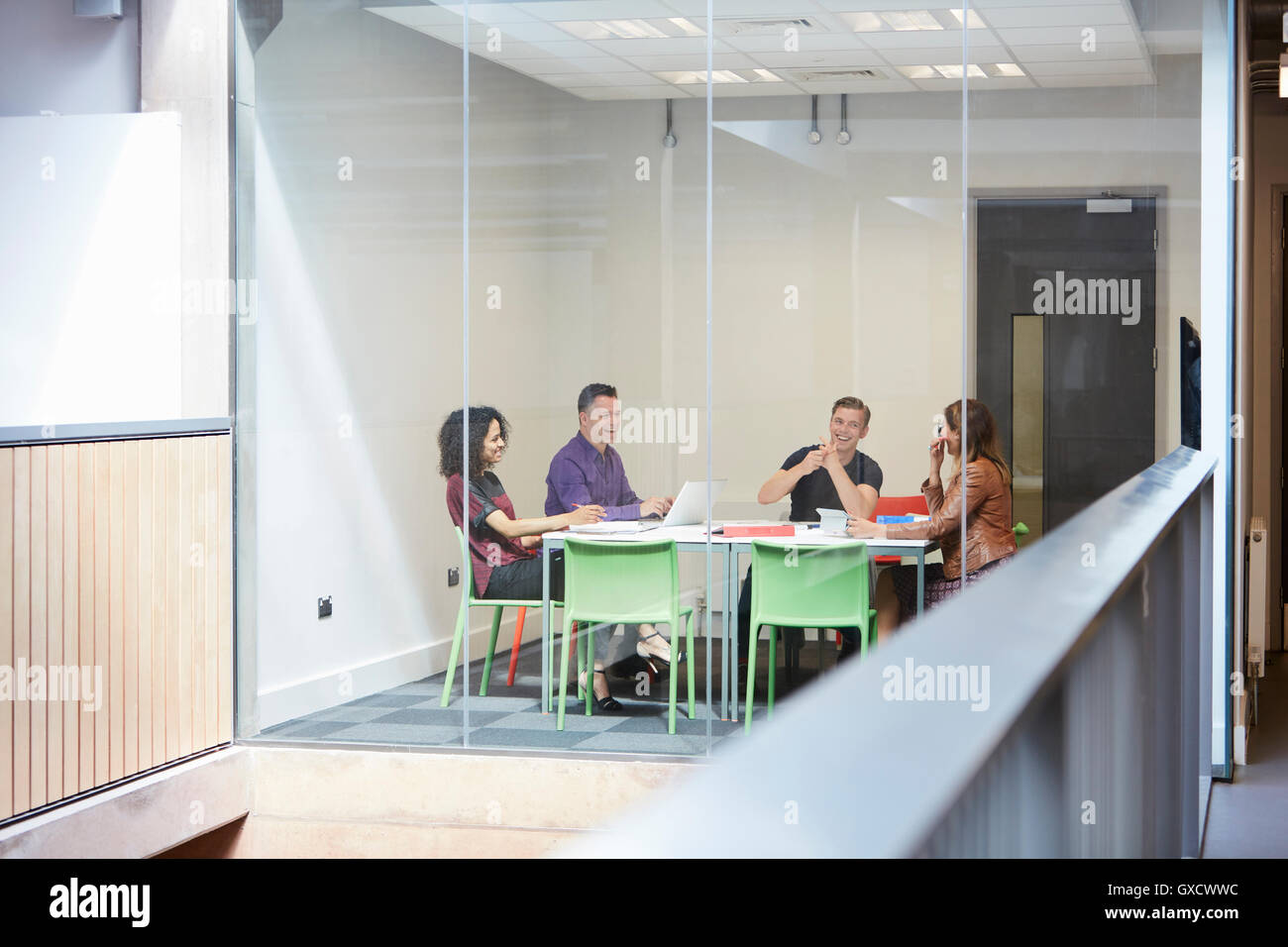 Design team meeting at design studio boardroom table Stock Photo - Alamy