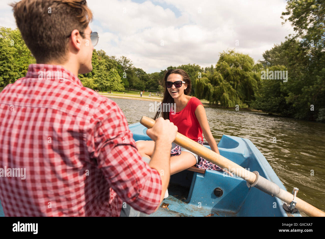 Young couple rowing a boat in Regents Park, London, UK Stock Photo - Alamy
