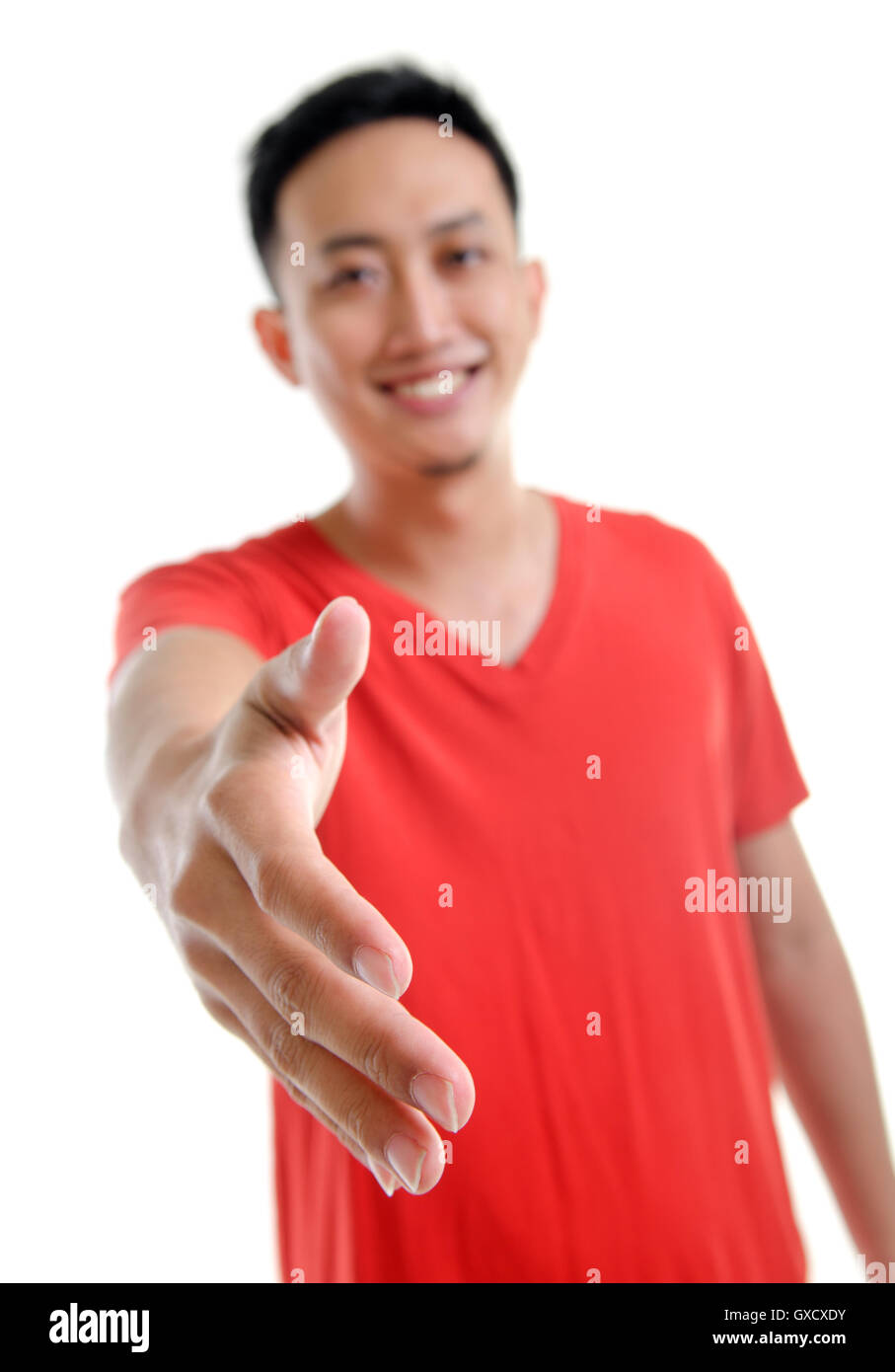Extending hand to give a handshake Stock Photo - Alamy