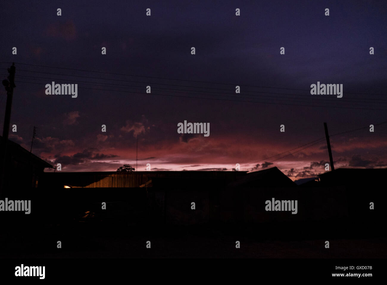 Dramatic red sky over building at night Stock Photo - Alamy