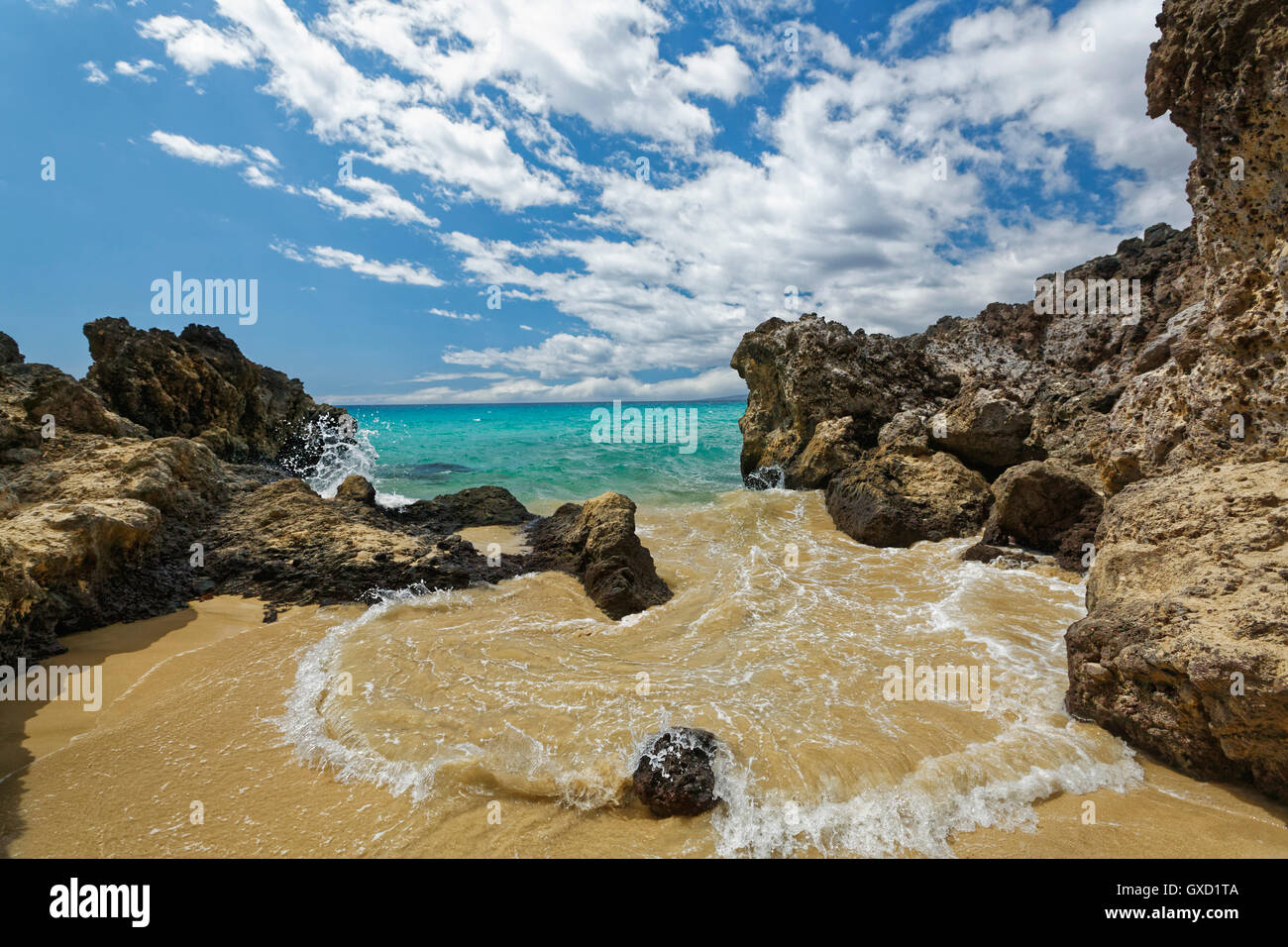 Hawaii beach and surf surrounded by volcanic rock taken on the big ...