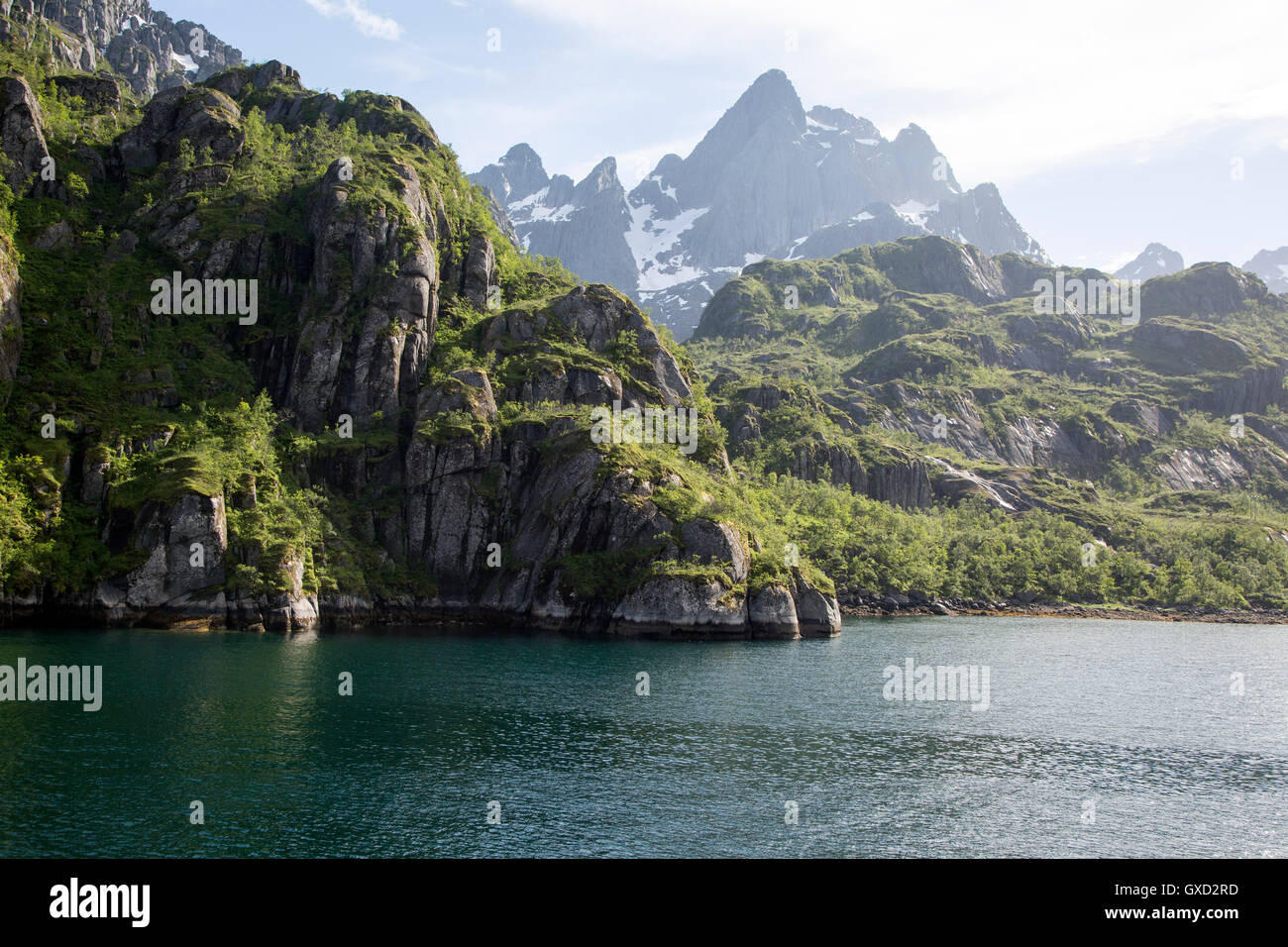 Steep sided glacial trough fiord jagged mountain peaks, Trollfjorden ...