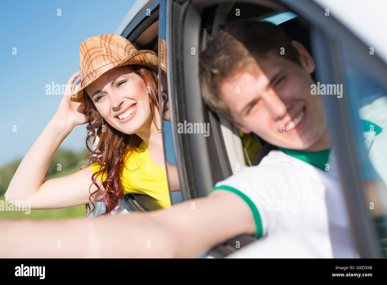 Young woman looking out of car window Stock Photo - Alamy