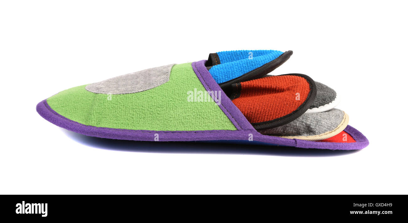 Colourful slippers into big slipper Stock Photo - Alamy