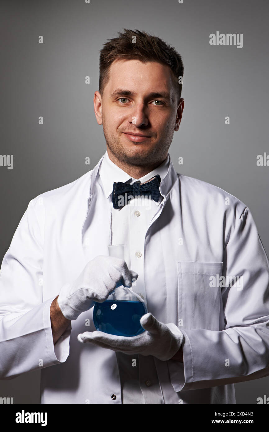 Scientist with chemical flask Stock Photo - Alamy