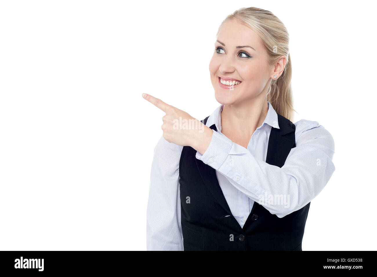 Lady pointing towards copy space area Stock Photo - Alamy