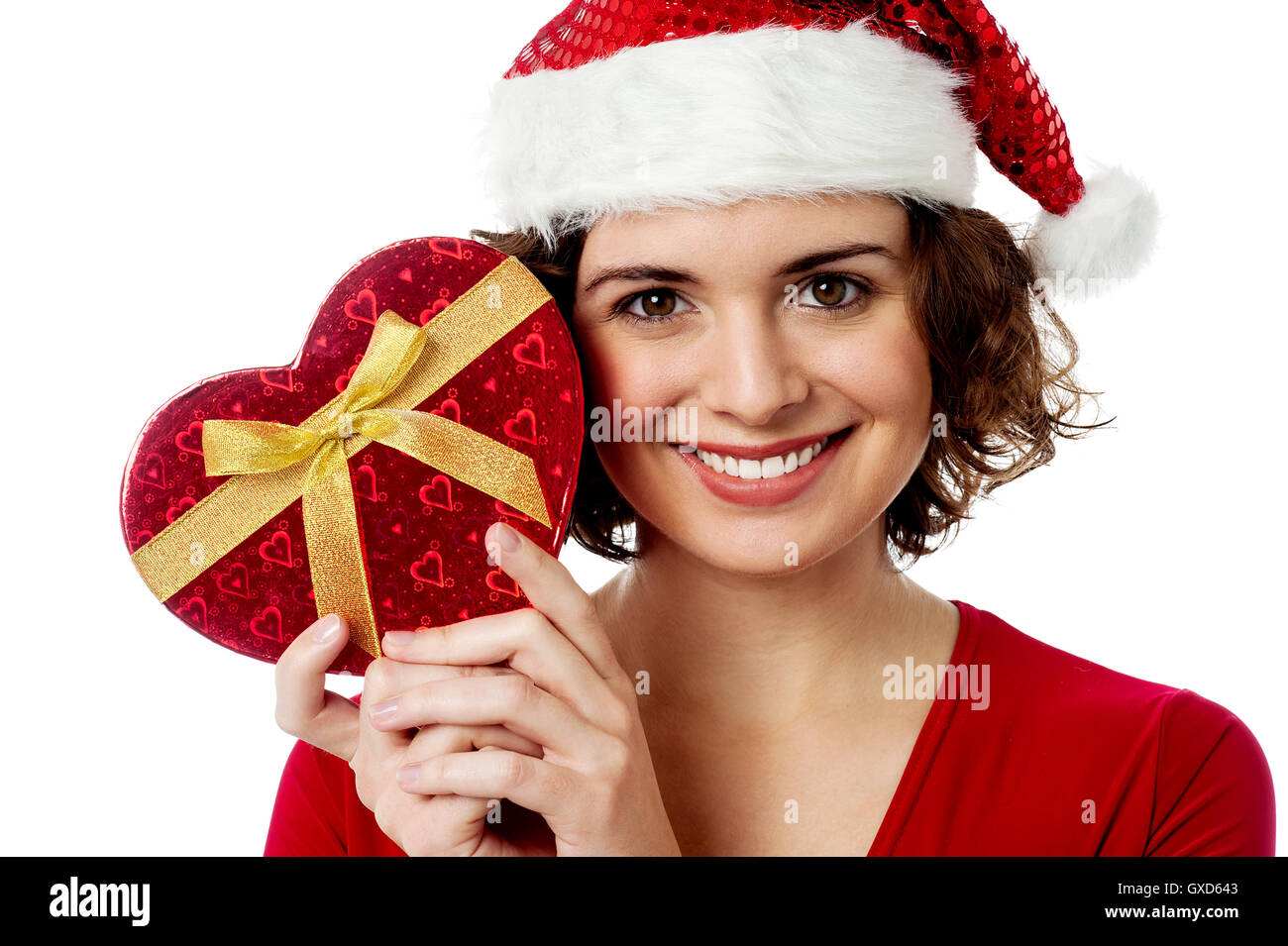 Female santa holding xmas gift Stock Photo - Alamy