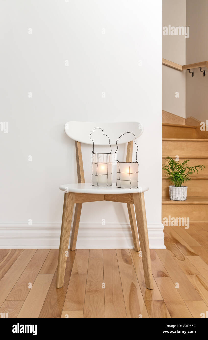 Lanterns on a white chair Stock Photo - Alamy