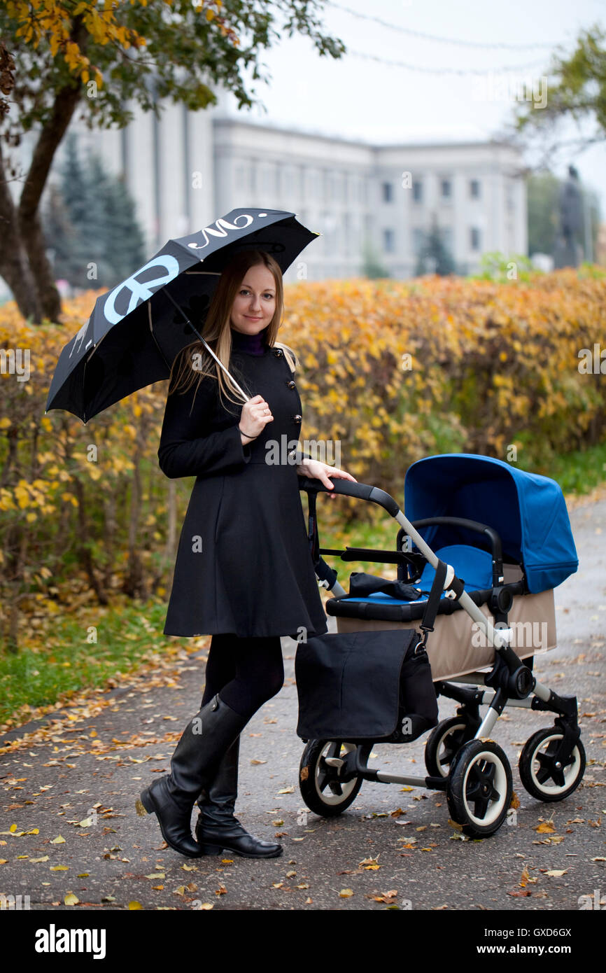 Mother with baby stroller for a newborn Stock Photo - Alamy