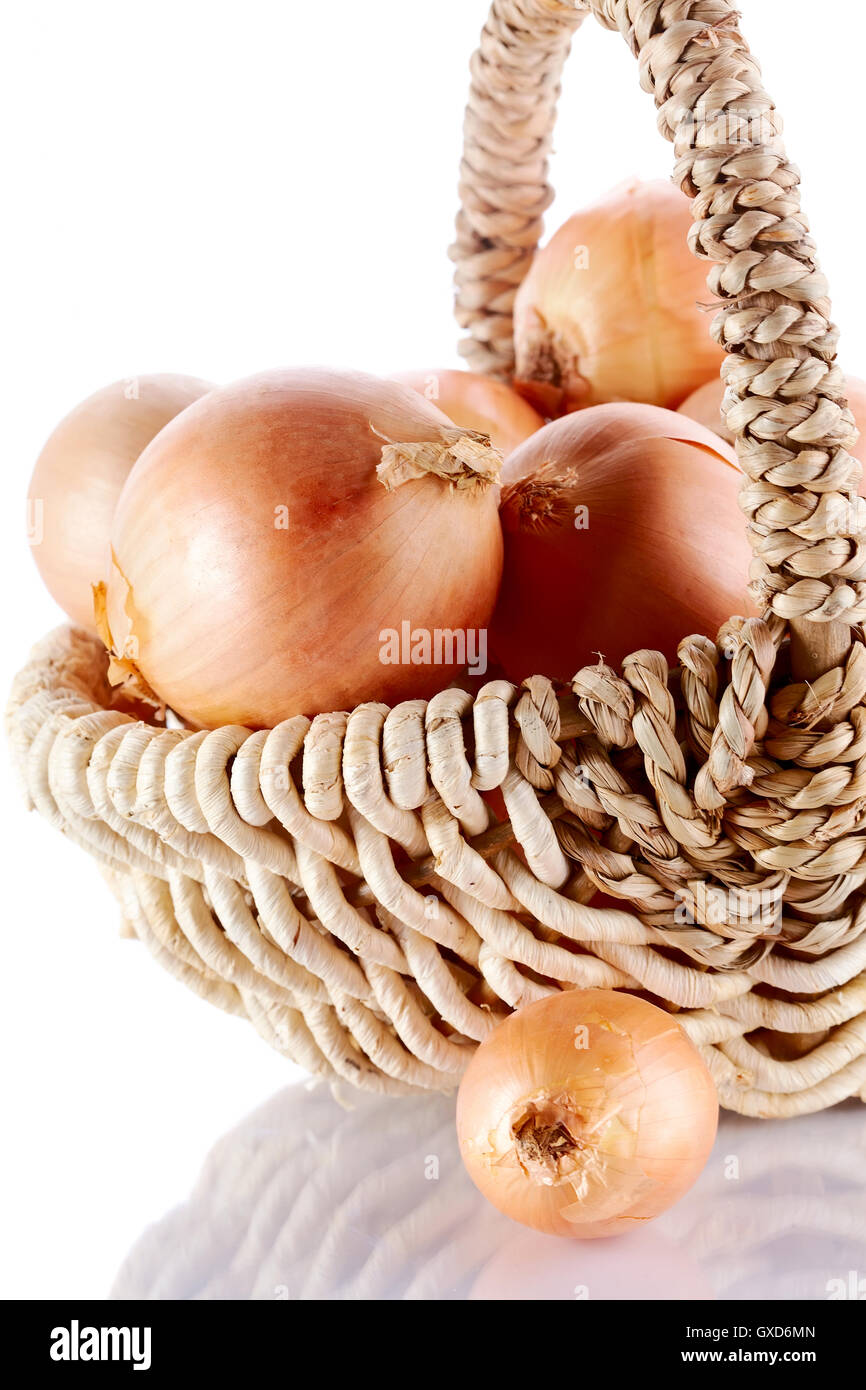 Onions napiform in a wattled basket Stock Photo - Alamy