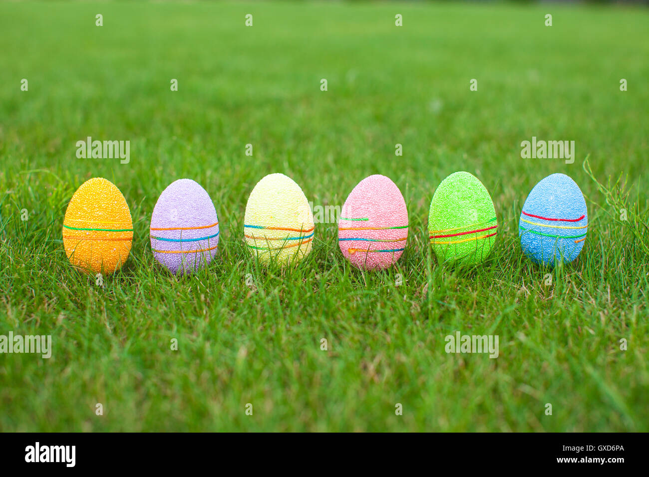 Colored colorful easter eggs in the grass Stock Photo - Alamy